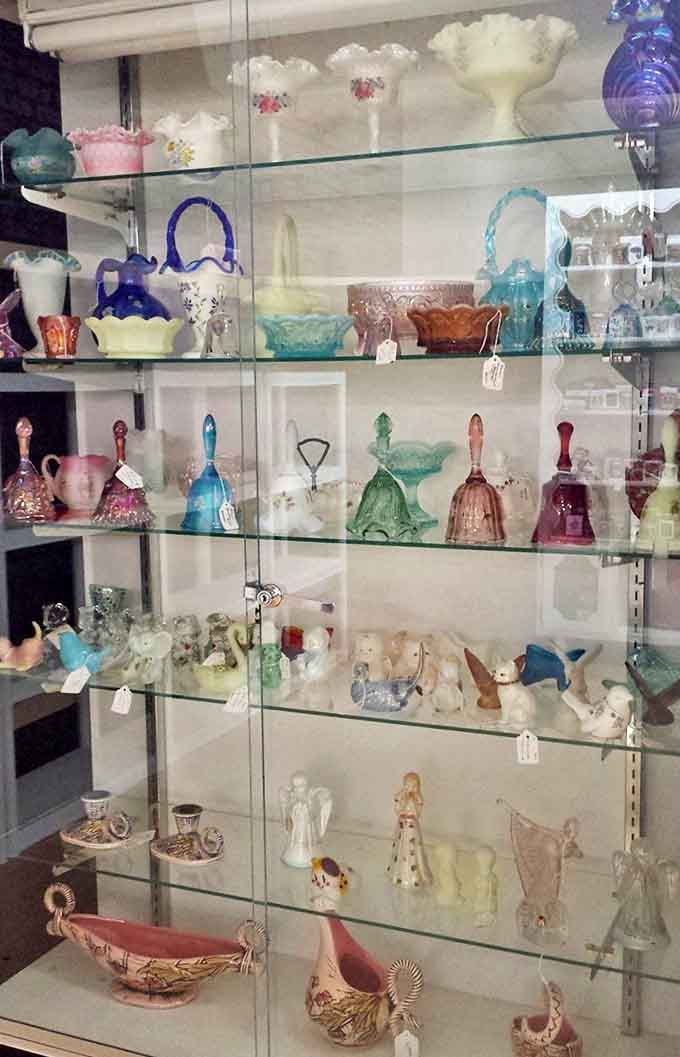 This carefully arranged display case showcases the delicate artistry of vintage figurines and colored glass that's increasingly hard to find.