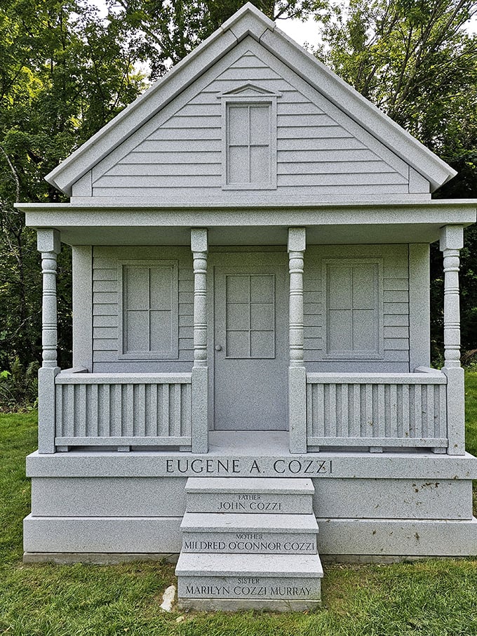 The Cozzi family memorial takes the form of a small cottage, complete with porch and perfect proportions.