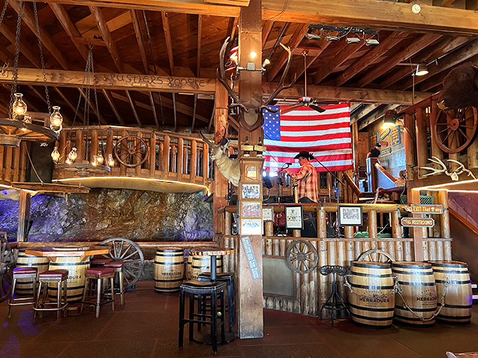 American flags, wagon wheels, and antlers adorn the multi-level dining space – creating an immersive Western experience that feels authentically Arizona.