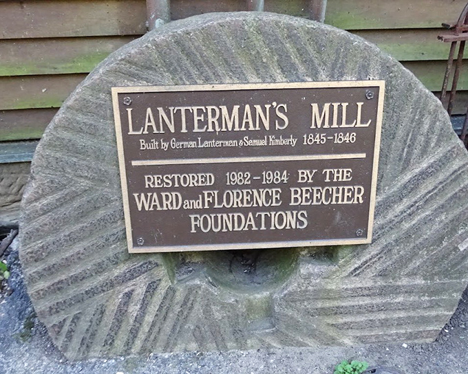The plaque reveals Lanterman's Mill's origins, a testament to German craftsmanship that's stood the test of time.