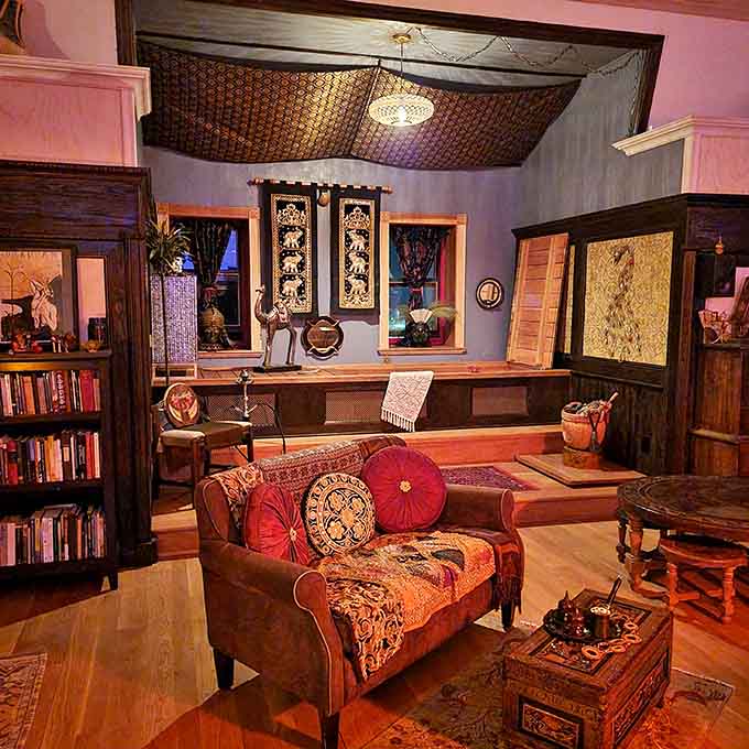 Rich fabrics and bold colors transform ordinary rooms into spaces where you half expect a Victorian ghost to offer tea.