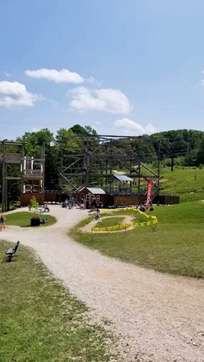 The large outdoor ropes course stands ready for climbers, blending adventure activities with Vermont’s wide-open landscape.