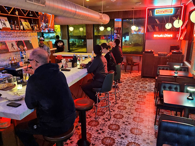 Evening vibes in full effect &ndash; warm lighting bathes the bar area as patrons gather to share stories and sample from the impressive drink menu.