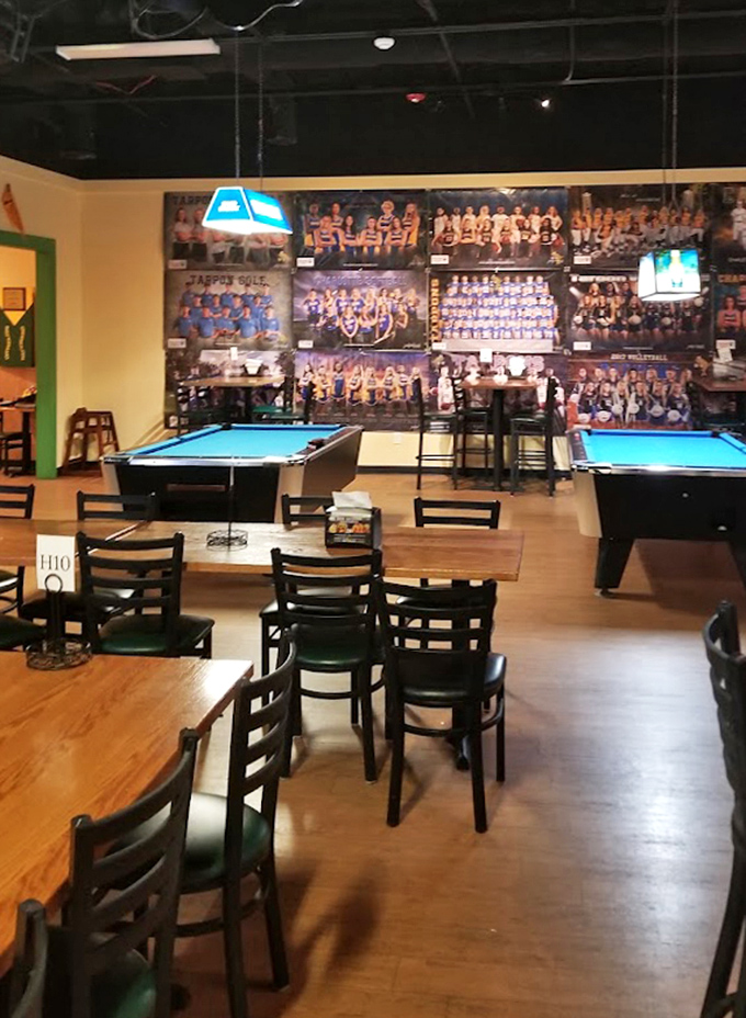 The wall of sports memories showcases local teams alongside pool tables, creating that perfect blend of hometown pride and entertainment options.