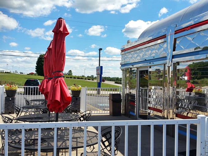 Al fresco dining, diner-style! Where the breeze carries hints of bacon and the umbrella provides shade for both you and your sky-high burger.