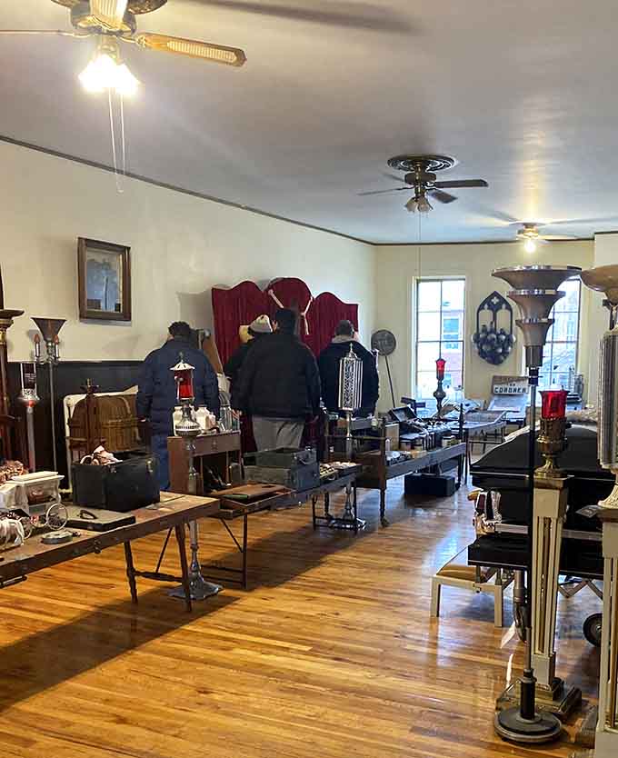 Visitors exploring the museum's treasures, probably debating which nightmare fuel to take home as a souvenir.