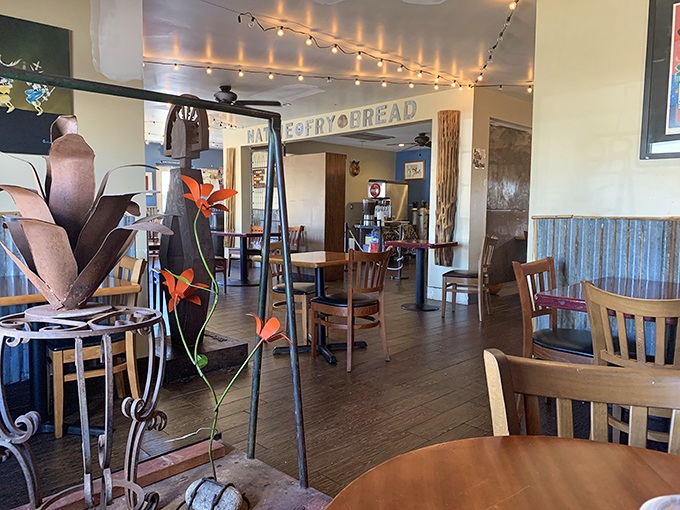 String lights add a touch of warmth to the casual dining space, creating an atmosphere that feels both special and relaxed.