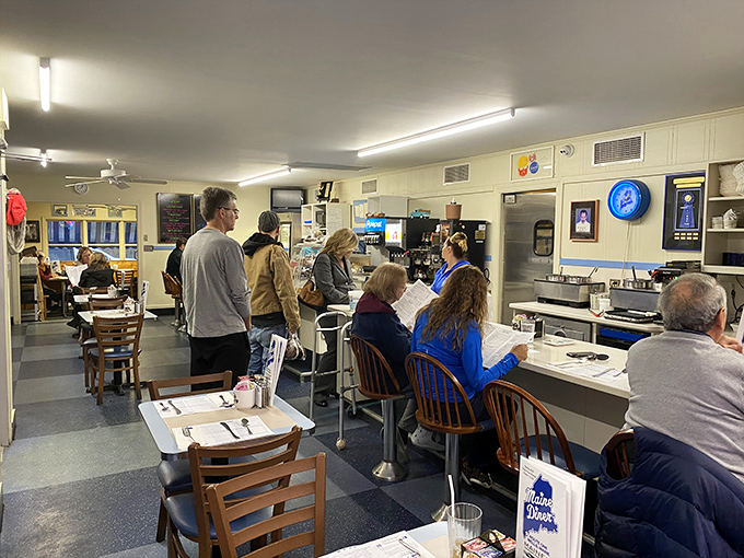 Blue booths and checkerboard floors create the classic diner atmosphere where countless memories have been made over plates of perfect seafood.