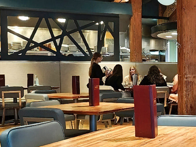 The open kitchen design lets you peek behind the culinary curtain. Where food magic happens before your very eyes!