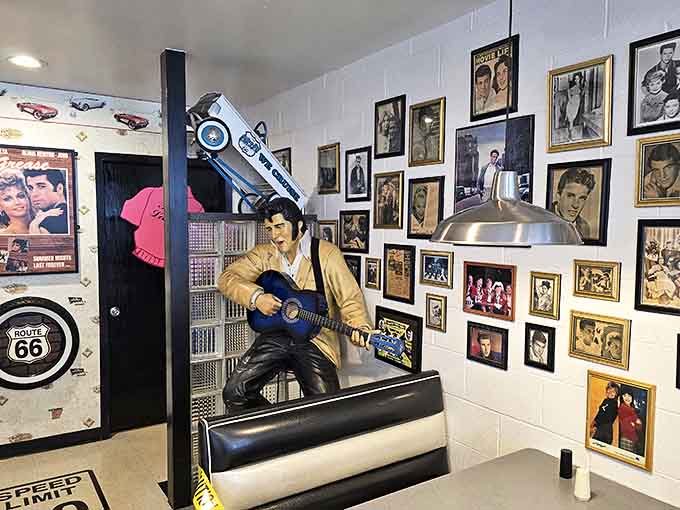 The King himself stands eternal guard, guitar in hand, reminding diners of an era when music and malt shops were inseparable companions.