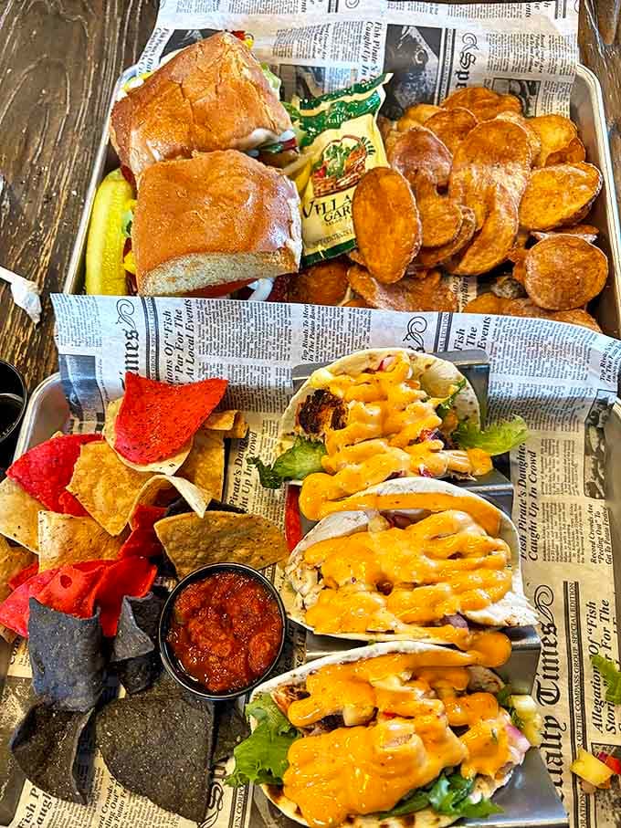 Newspaper-lined trays hold colorful tacos, chips and house-made salsa &ndash; casual presentation that lets the vibrant flavors take center stage.