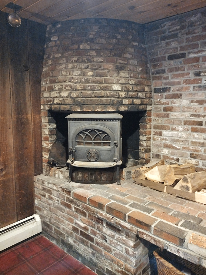 This wood-burning stove doesn't just provide warmth – it creates that magical Vermont ambiance that makes you want to linger all day. Photo credit: <a href="https://maps.google.com/maps/contrib/101102507640097437287" target="_blank" rel="noopener noreferrer">Melinda Marino</a> This wood-burning stove doesn't just provide warmth – it creates that magical Vermont ambiance that makes you want to linger all day.