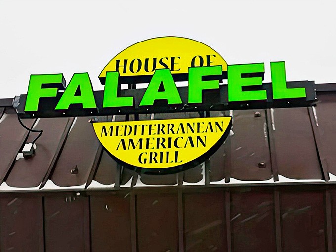 The restaurant's name in bold green letters &ndash; a beacon for those seeking authentic Mediterranean flavors in Michigan's suburbs.