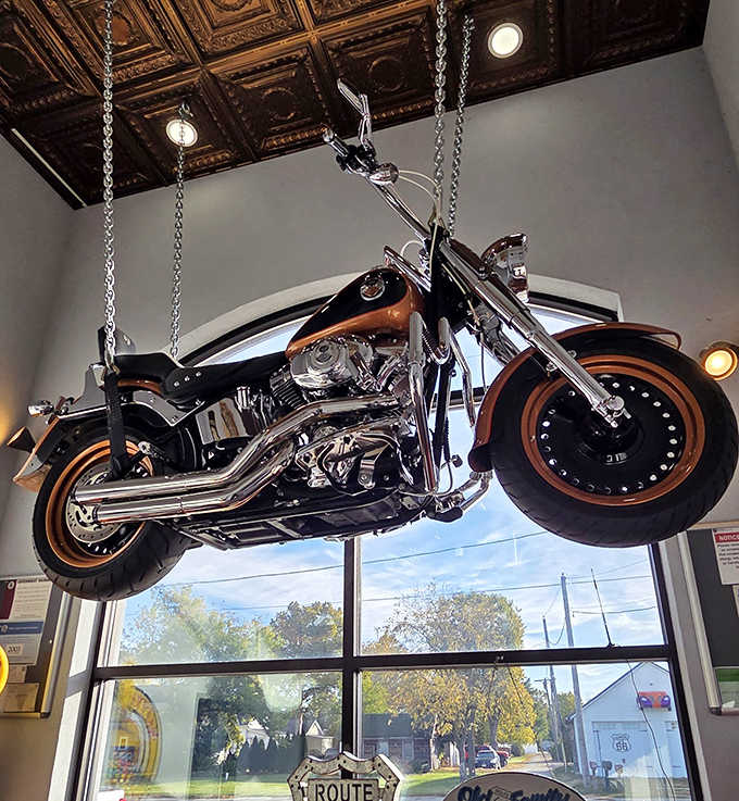 A motorcycle suspended from the ceiling, because when your food is this good, even the d&eacute;cor defies gravity.