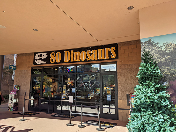 Eighty different dinosaur species under one roof! This entrance sign isn't just clever marketing—it's an accurate count of the prehistoric diversity inside.