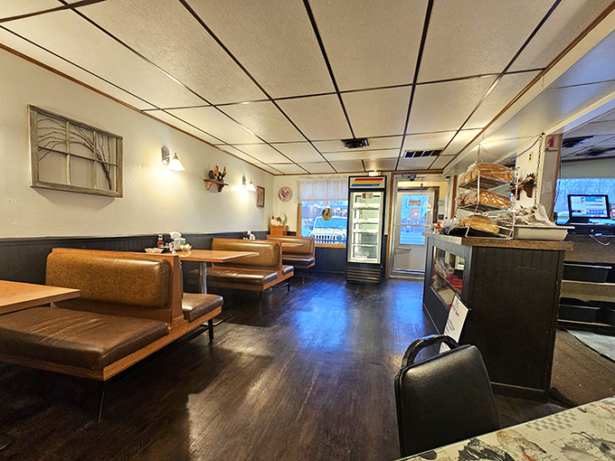 The dining area's warm wood tones and comfortable booths invite you to linger over coffee and conversation &ndash; no rushing here.