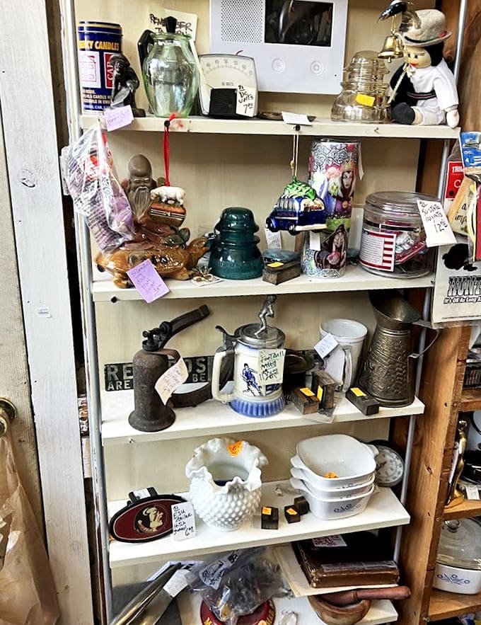 This shelf of vintage kitchenware and collectibles proves that before things were "retro cool," they were just everyday objects someone cared enough to preserve.