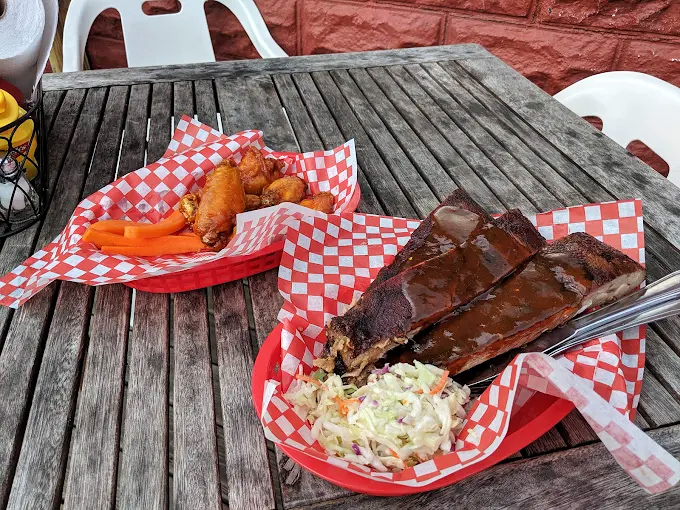 This basket of ribs and wings isn't just lunch&mdash;it's a commitment to excellence that requires both hands and several napkins.