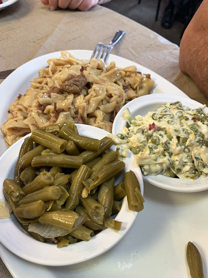 A generous plate of noodles, green beans, and creamy pea salad&mdash;pure Midwestern comfort food.