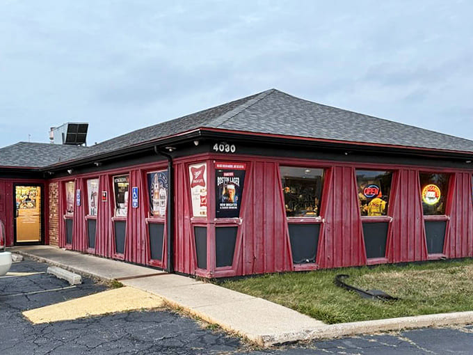The building's exterior shows its personality with vintage beer signs and that distinctive red siding, like a barbecue joint and a roadhouse had a delicious baby.