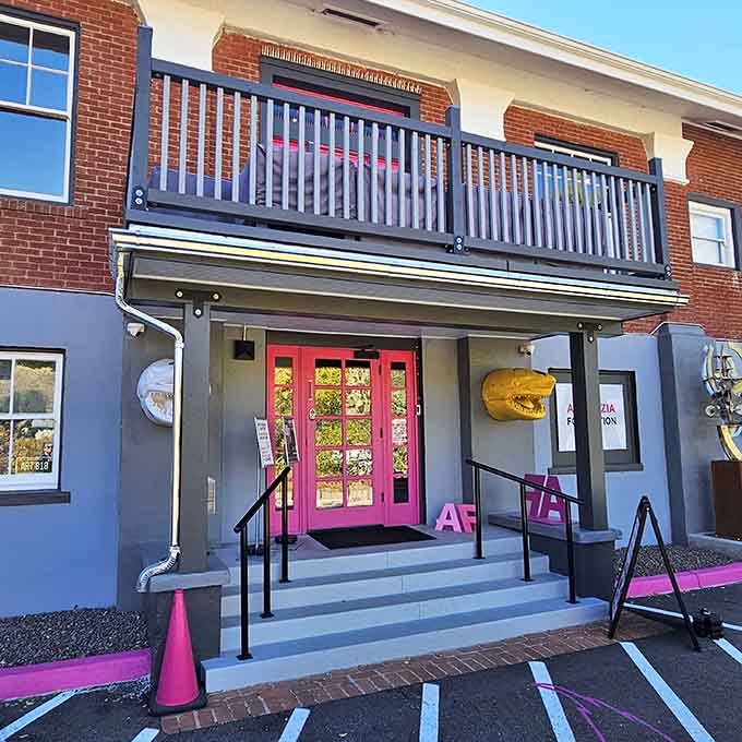 The Artemizia Foundation's bright pink entrance practically demands attention, announcing that art here isn't whispered about in hushed tones but celebrated with bold, unapologetic color.