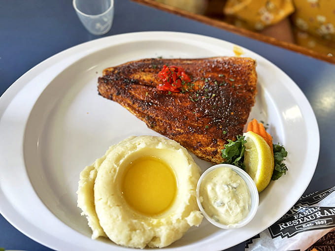 Blackened catfish with perfectly seasoned crust and tender interior &ndash; proof that inland Michigan knows its seafood.