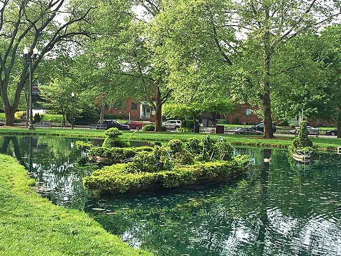 These shrub sailors navigate their leafy vessel across the reflective pond, creating a scene straight from Seurat's imagination.