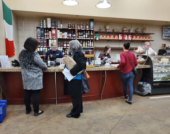The counter stays busy with customers ordering sandwiches, asking questions, and probably leaving with more than they planned to buy.