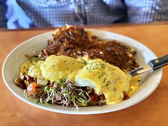 The California Benedict arrives like breakfast royalty &ndash; perfectly poached eggs draped in hollandaise, accompanied by crispy hash browns fit for morning royalty.
