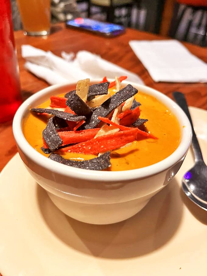 The chicken tortilla soup brings unexpected southwestern warmth to Michigan's north country, topped with colorful tortilla strips for texture and flair.