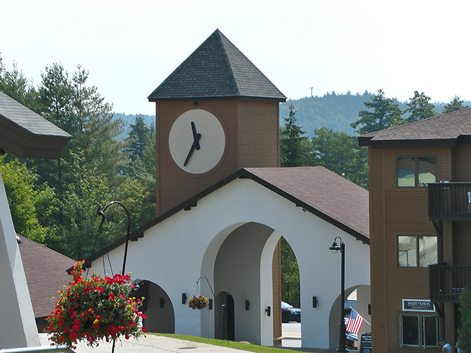 Okemo's charming clock tower entrance welcomes visitors to a mountain resort that balances natural beauty with exciting attractions.