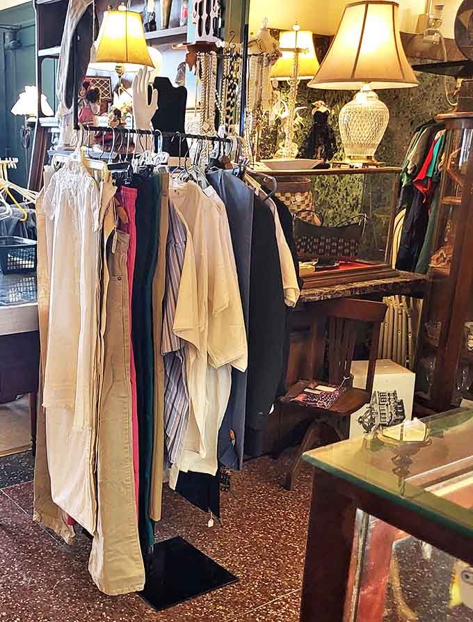 Yesterday's fashion hangs with dignified patience, each garment whispering stories of dances, dinners, and days when dressing up was standard.