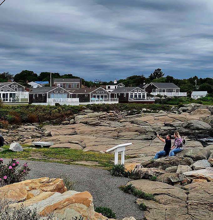Charming coastal homes line the shore, their weathered shingles telling stories of countless ocean views.