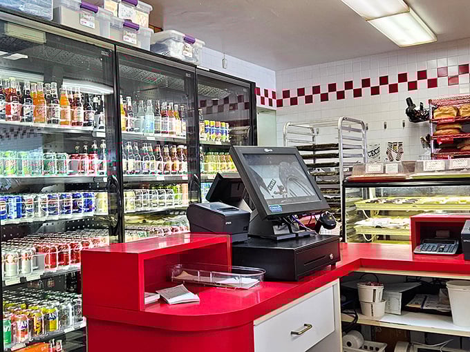 Welcome to Cecil's Deli! The red counter and soda fridge are ready for your next delicious meal and drink.