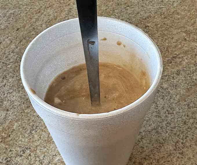 A chocolate shake thick enough to require genuine effort with that straw, which is exactly how shakes were meant to be enjoyed.
