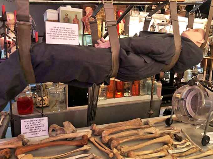 Dead Body Hoist: This grim apparatus once lifted the departed with mechanical efficiency, a stark reminder of death's physical realities behind funeral home curtains.