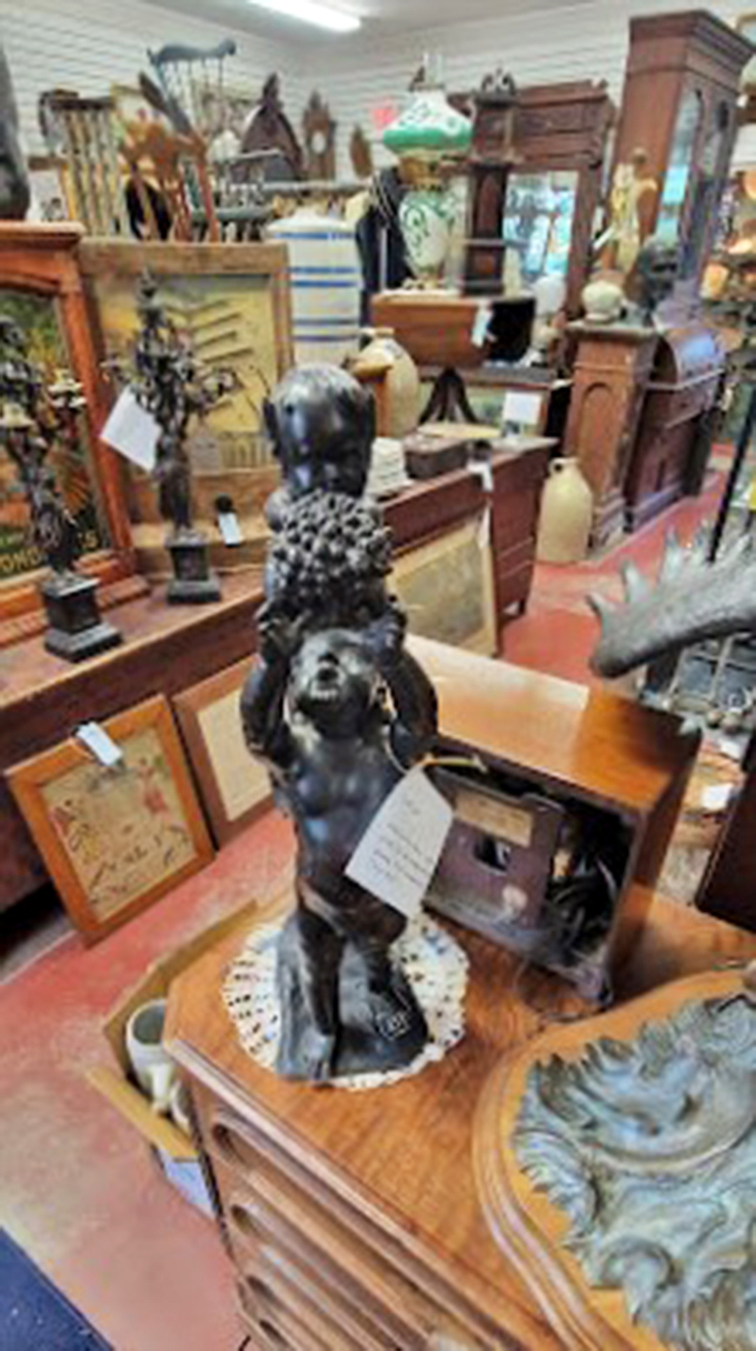 Bronze figures and ornate frames create an artistic symphony that would make any antique enthusiast swoon.