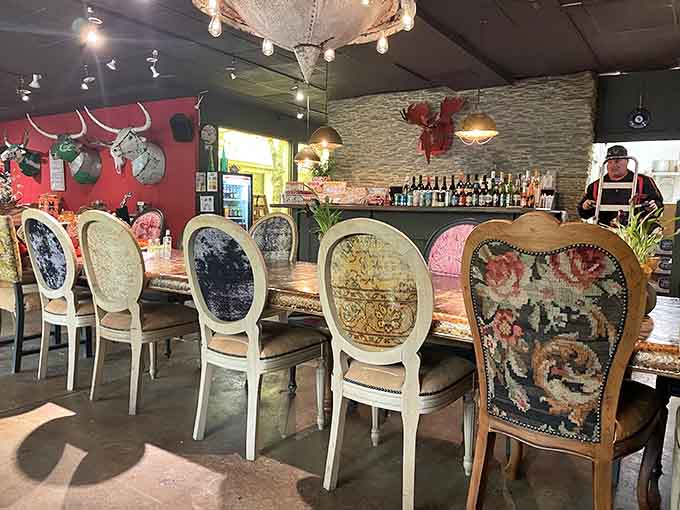 The communal dining table surrounded by furniture for sale creates an atmosphere that shouldn't work but absolutely does.