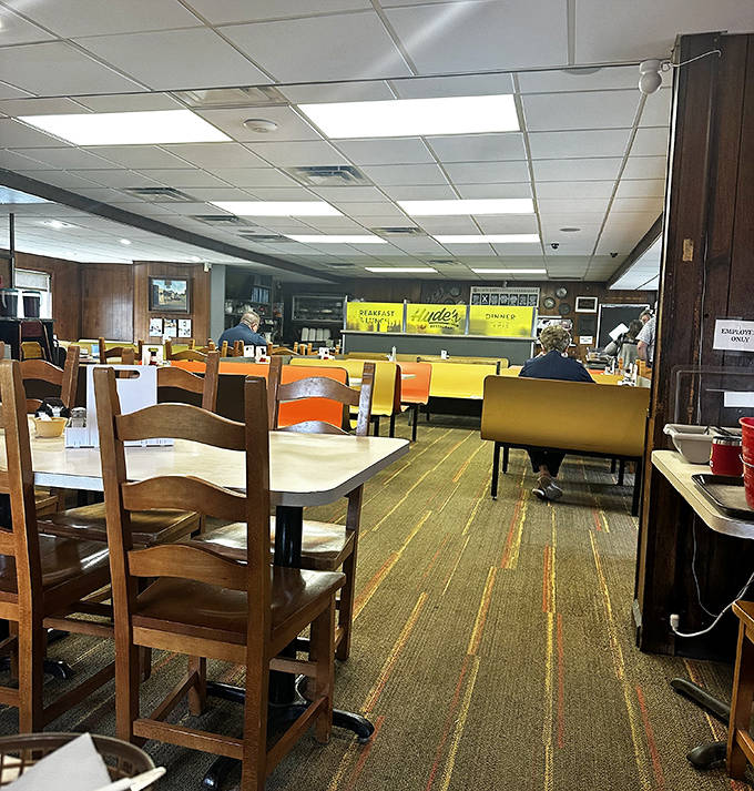 Laminated placemats and condiment caddies wait patiently for the next round of regulars to slide into these well-worn seats.