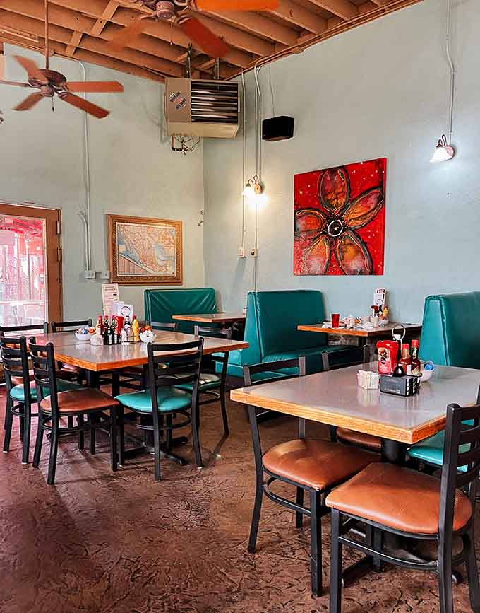 Turquoise booths and exposed beams give this dining room character that chain restaurants can only dream about.