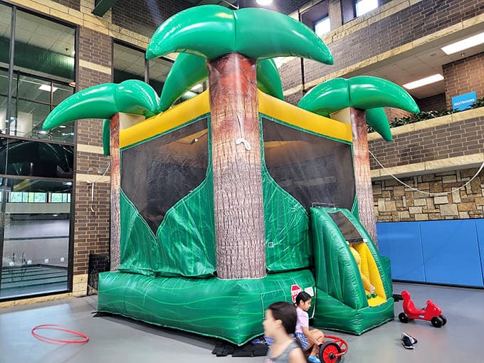 That inflatable bounce house with palm trees brings a touch of tropical vacation to Minnesota, minus the expensive plane tickets.