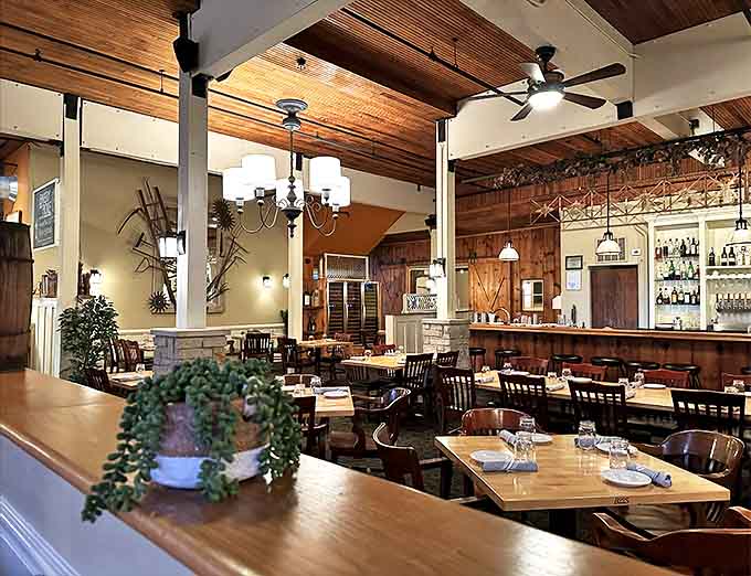 The dining area balances rustic charm with refined elegance. Every table offers the perfect vantage point for people-watching between courses.