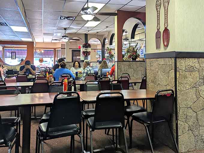 Happy diners dig into their meals, their expressions saying what words cannot about those legendary gyros.