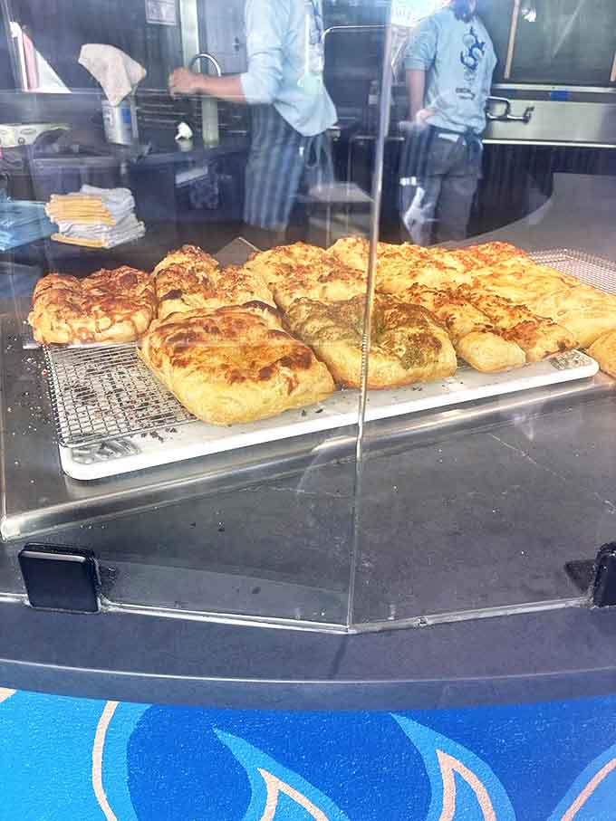 Focaccia that makes Italian grandmothers nod in approval – golden, dimpled perfection waiting to be devoured.