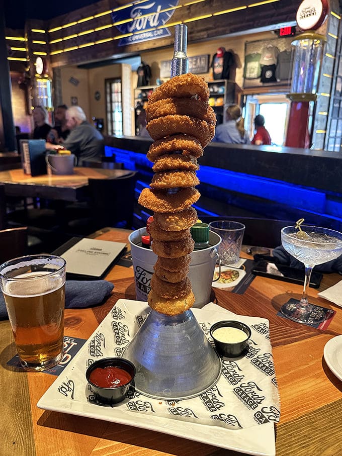 These onion rings stack higher than a mechanic's tool chest, a golden tower of crispy perfection that demands to be shared.