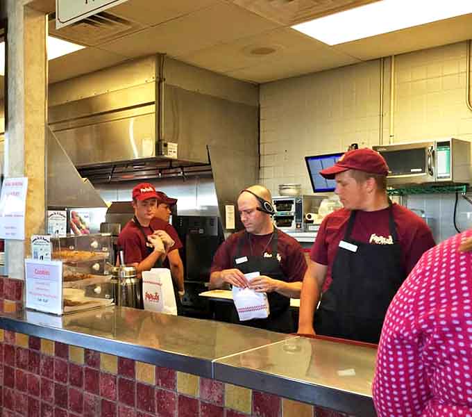 The team behind the counter moves with choreographed precision &ndash; these aren't just employees, they're craftspeople dedicated to their delicious art.