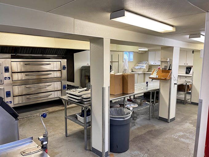 The heart of the operation where dough becomes art, equipped with serious ovens that know how to deliver that perfect crispy crust.