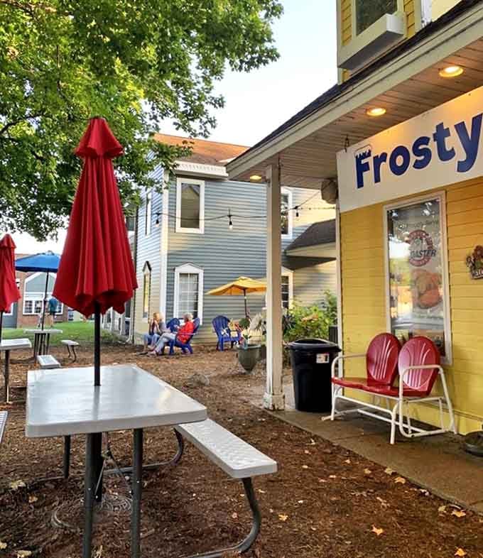Outdoor seating sanctuary: Red chairs invite you to slow down and savor both your treat and the moment.
