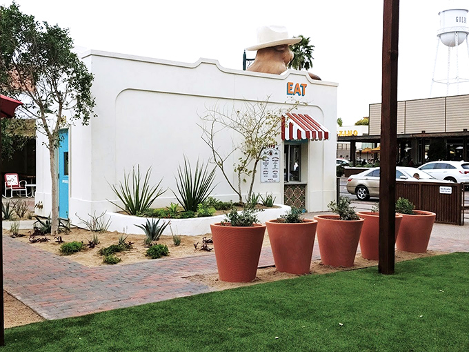 The charming white building with its distinctive red awning stands out in downtown Gilbert's Heritage District.