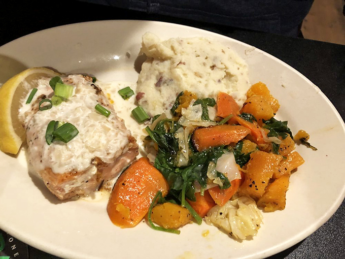 This fresh salad topped with grilled chicken proves that pub food isn't all about indulgence &ndash; lighter options shine with equal care. 